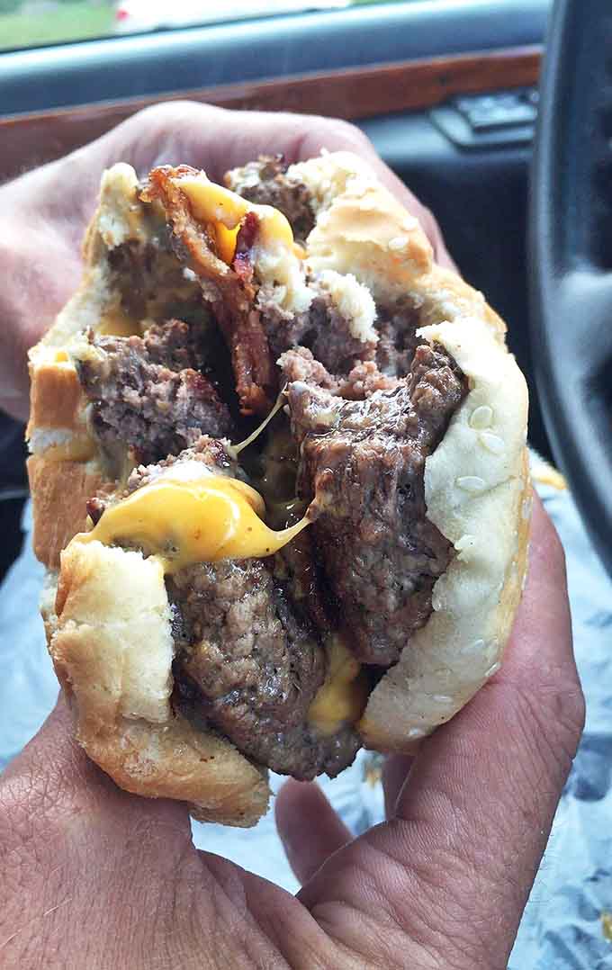 This isn't just a cheeseburger, it's a work of art, where beef and cheese perform their timeless dance of flavor on a sesame seed stage.