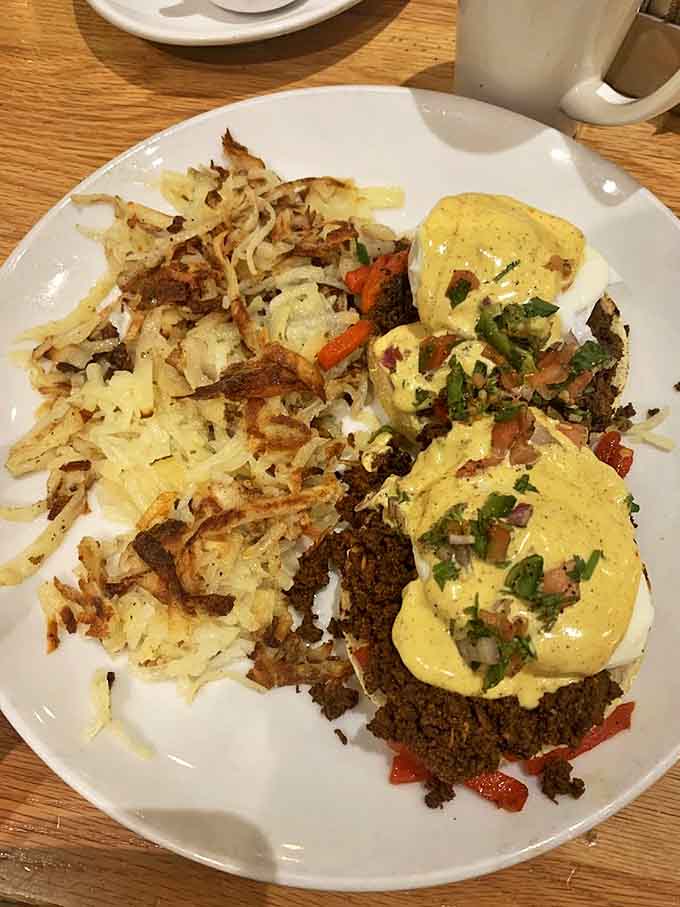 Eggs Benedict elevated to art form &ndash; perfectly poached eggs nestled atop savory ingredients, all bathed in hollandaise that would make a French chef weep.