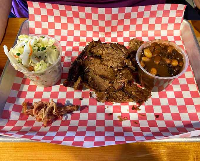 A brisket plate with all the fixings represents barbecue perfection on a red-checkered canvas of deliciousness.