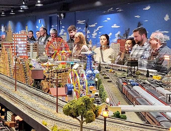 The homemade locomotive creation outside – proof that train enthusiasm extends beyond the miniature world inside.