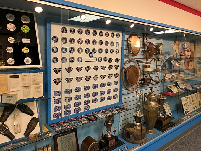 A rainbow of company badges and insignia showcases the pride drivers took in their profession throughout the decades.