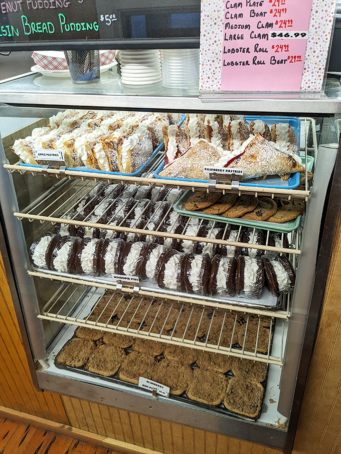 The dessert case – a glass-fronted temple of temptation where willpower goes to die and happiness begins.