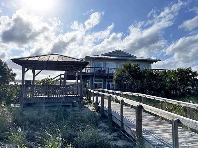 This charming beachfront structure stands as a sentinel overlooking the water, weathered by salt air and countless sunsets.