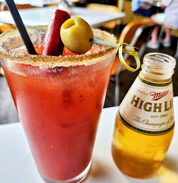 That Bloody Mary isn't just a drink &ndash; it's a garden in a glass, standing proudly next to its beer sidekick like the perfect morning-after power couple.