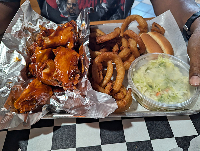 Saucy wings alongside crispy calamari rings &ndash; proof that Charlie's excels beyond just barbecue, mastering the art of the perfect appetizer too.