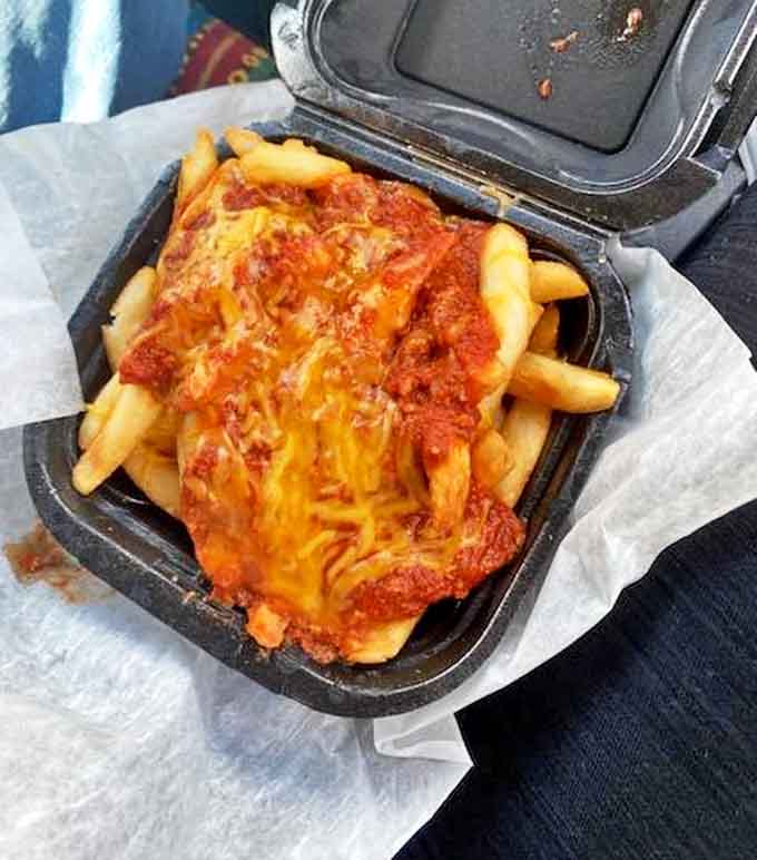 When cheese meets chili meets fries, magic happens &ndash; this gooey, savory masterpiece might require a fork, but no one's complaining about the extra effort.