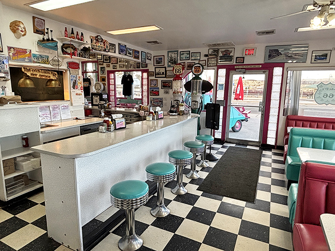 Chrome stools invite spinning contests while the counter promises front-row seats to the short-order ballet behind it.