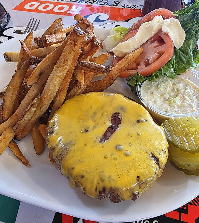 Lunch perfection with hand-cut fries, house-made slaw, and a burger that could make dedicated burger joints jealous of its juicy glory.