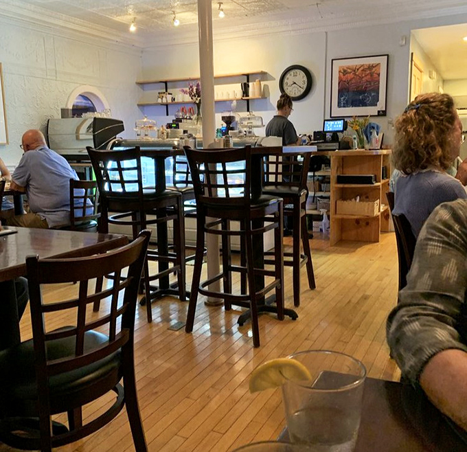 The dining room hums with satisfaction &ndash; wooden floors worn smooth by generations of seafood pilgrims seeking Maine's finest maritime treasures.