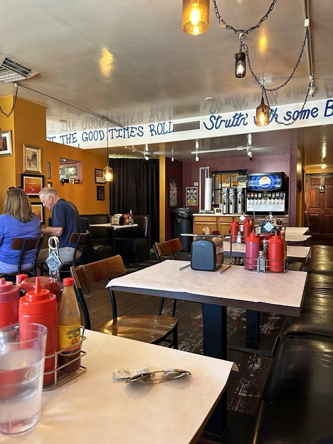 "Let the Good Times Roll" banner watches over diners as they savor Southern specialties in this jazz-inspired dining room.