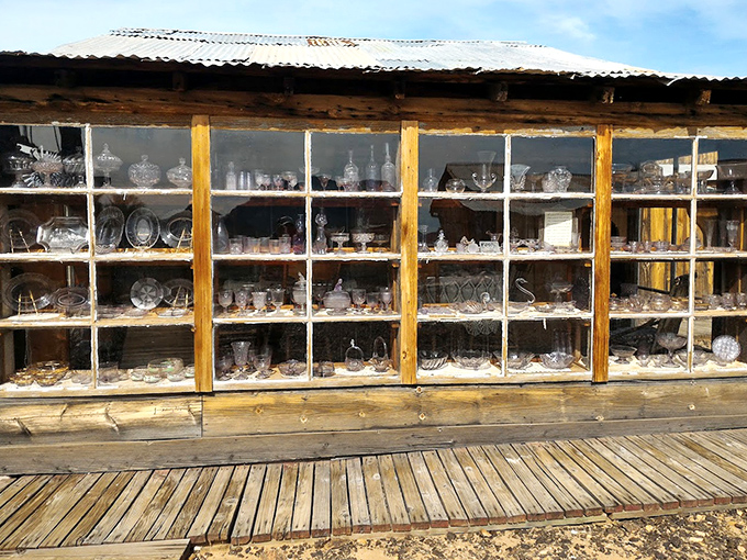 Delicate glassware that somehow survived the journey west and a hundred harsh summers. Each piece represents a small luxury in a hardscrabble existence.