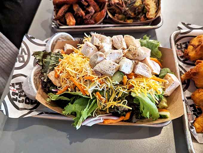 A salad so fresh and vibrant, it almost makes you forget you came for the fried chicken. Almost.