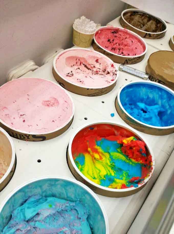 A painter's palette of frozen joy – from cotton candy blue to strawberry pink, each tub contains not just ice cream, but potential memories waiting to be scooped.