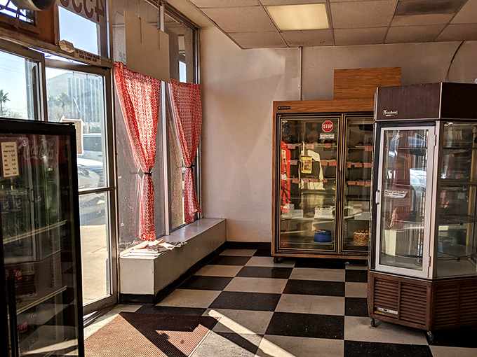 Simple red curtains frame the windows of this unpretentious bakery, where the focus remains squarely on what matters most: exceptional baked goods.