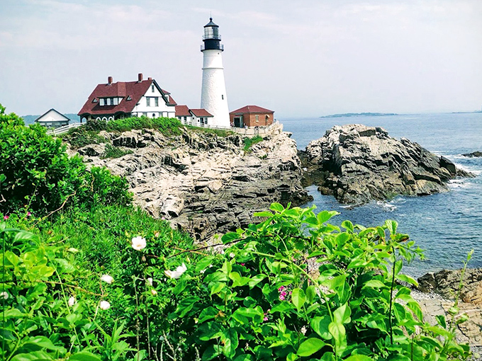Against a brilliant blue sky, the lighthouse's classic silhouette has guided generations of mariners safely into Portland Harbor.