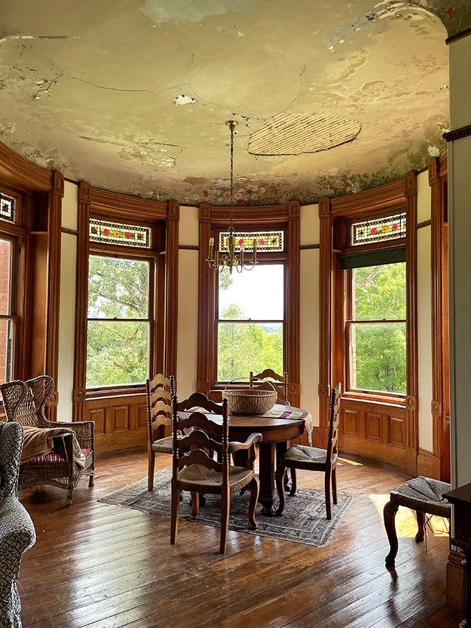 This dining nook with its painted ceiling proves that even casual meals deserved an artistic backdrop in the castle's heyday, because why not?