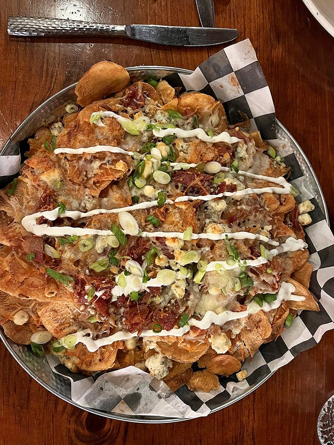 These aren't just nachos&mdash;they're an architectural achievement of crispy chips, melted cheese, and toppings that somehow maintain structural integrity until the last bite.