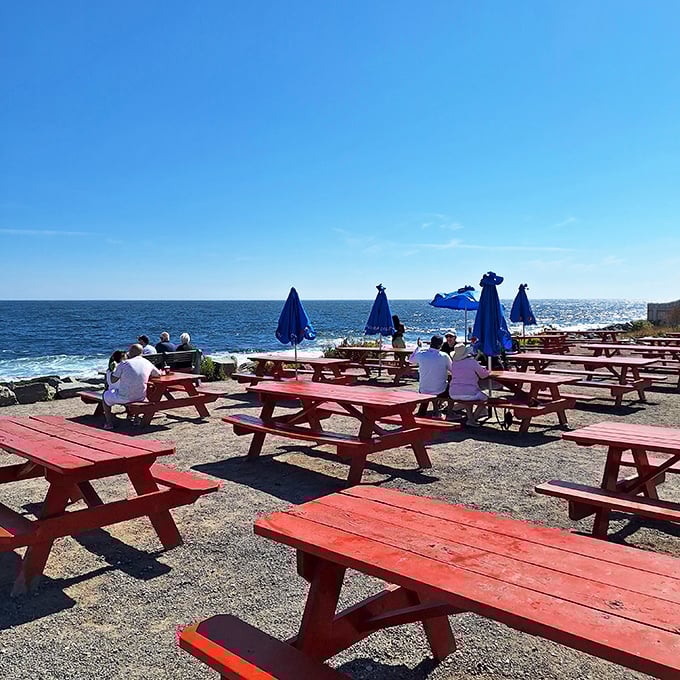 Bright red picnic tables scattered across the rugged terrain offer nature's finest dining room with unobstructed Atlantic Ocean panoramas.