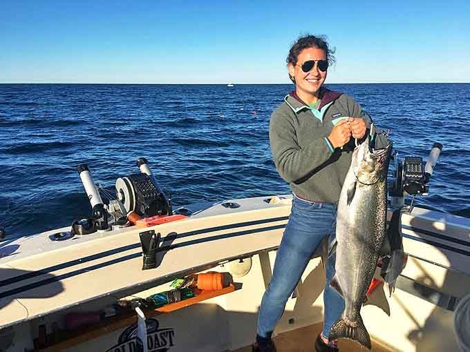 Nothing says "vacation success" quite like holding up a freshly caught Lake Michigan salmon, a delicious trophy of patience and skill.