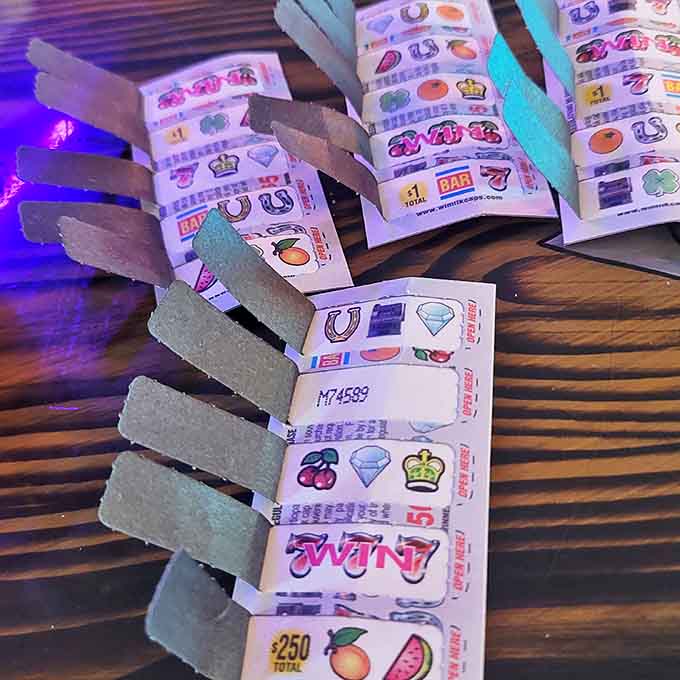 Pull-tab lottery tickets add another layer of gaming chance for visitors looking to test their luck beyond digital challenges.