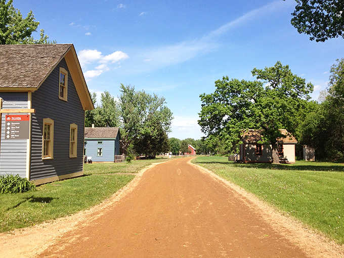 Rustic dirt roads connect the village buildings, their reddish hue a reminder that modern pavement was once an unimaginable luxury.