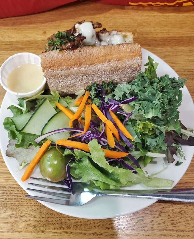 The steak sandwich experience, complete with fresh salad &ndash; a meal that satisfies deeply without weighing you down for your Grand Marais adventures.