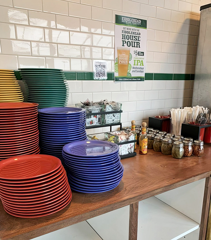 Colorful plates stand ready for pizza duty &ndash; a rainbow of ceramic soldiers awaiting their delicious mission.