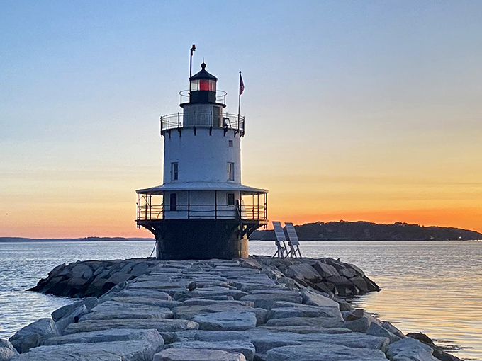 Sunset transforms Spring Point Ledge Lighthouse into a silhouette against the painted sky, rewarding patient photographers with Maine's golden hour magic.