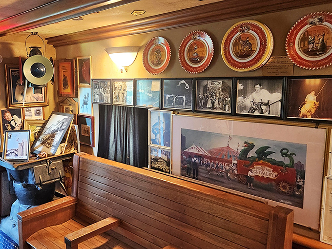 Circus memorabilia transforms dining car walls into a museum of American entertainment history, where every photograph tells a story of wonder.