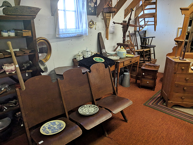 Church pew meets parlor chair in this collection of vintage wooden furniture &ndash; functional history waiting for its next chapter in someone's home.