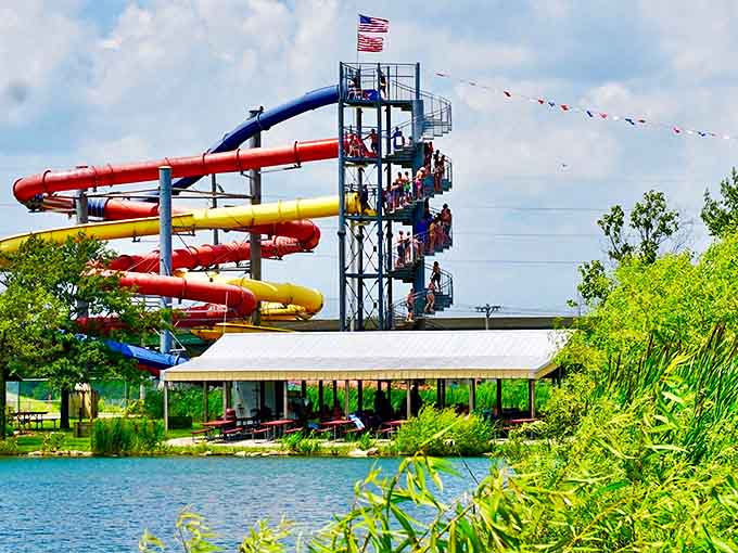 Colorful water slides twist against the blue Illinois sky, promising an exhilarating journey ending with the universal waterslide dismount &ndash; graceless but joyful.