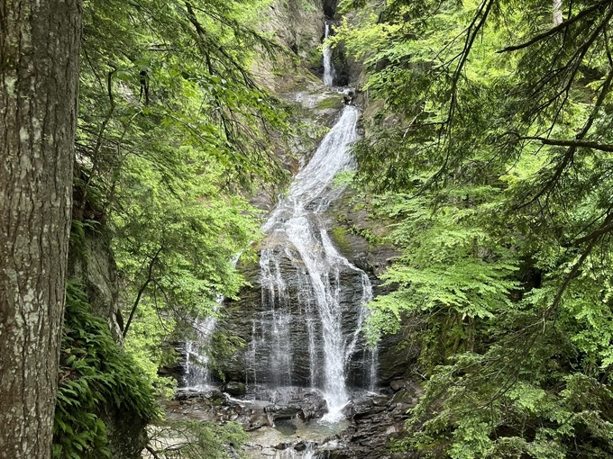 The waterfall's middle section offers a mesmerizing display of water dancing over ancient stone faces.