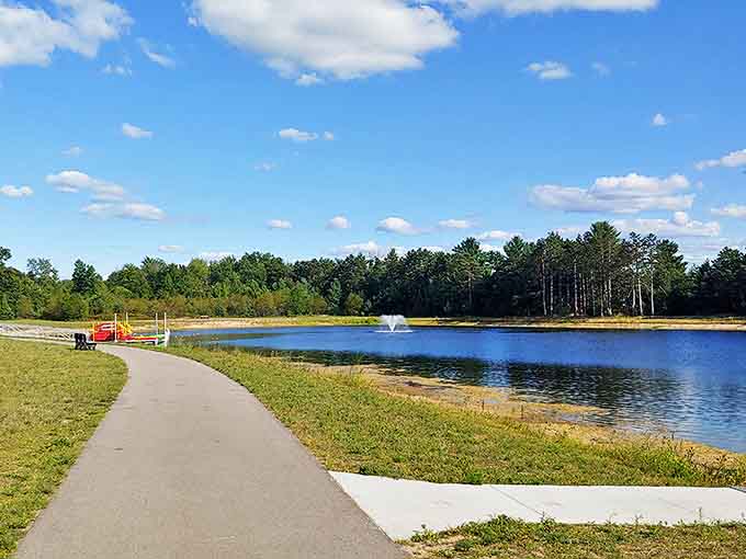 Pond: Nature's mirror reflects cotton candy skies and tall pines, creating moments of unexpected tranquility in the midst of vacation chaos.
