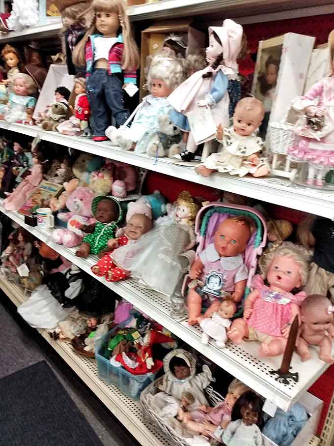 The sidewalk display offers garden treasures and outdoor collectibles, with vintage wagons and weathered toys creating an inviting preview of wonders within.