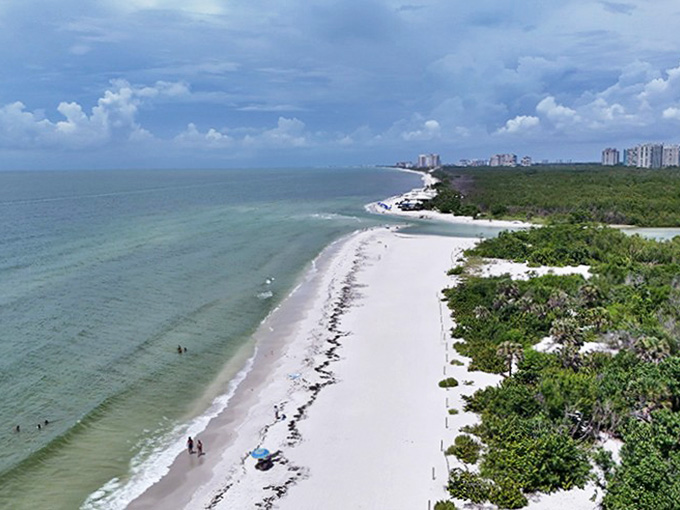 From above, the pristine coastline reveals itself like a painter's masterpiece of turquoise waters meeting sugar-white sands.