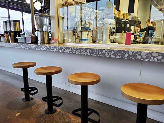 Counter seating offers front-row views of the bakery magic, like dinner theater but with better snacks.