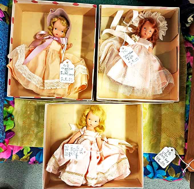 These delicate Nancy Ann Storybook dolls rest in their original packaging like tiny time capsules of childhood dreams from another era.