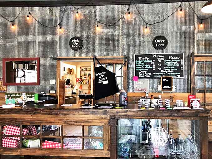 The rustic counter area where orders are placed and dreams of smoked meat come true, one plate at a time for hungry customers.