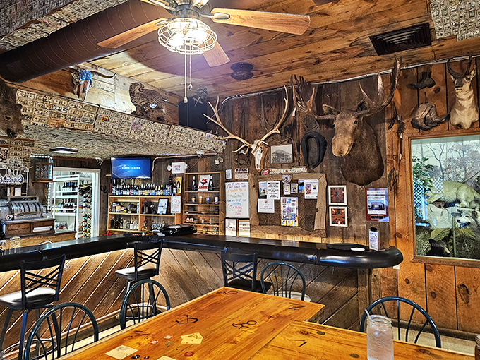 Dollar bills and hunting trophies create the ultimate roadhouse atmosphere in a bar area that invites lingering conversations.