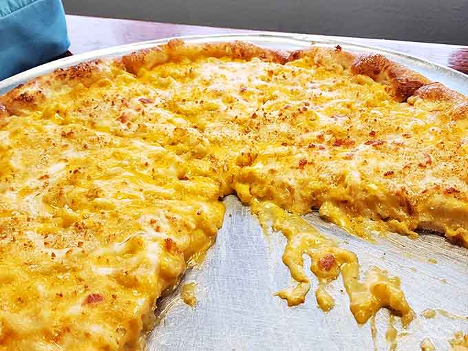 The true test of any pizzeria &ndash; a perfect cheese pizza with that ideal balance of crust, sauce, and stretchy mozzarella that haunts dreams.