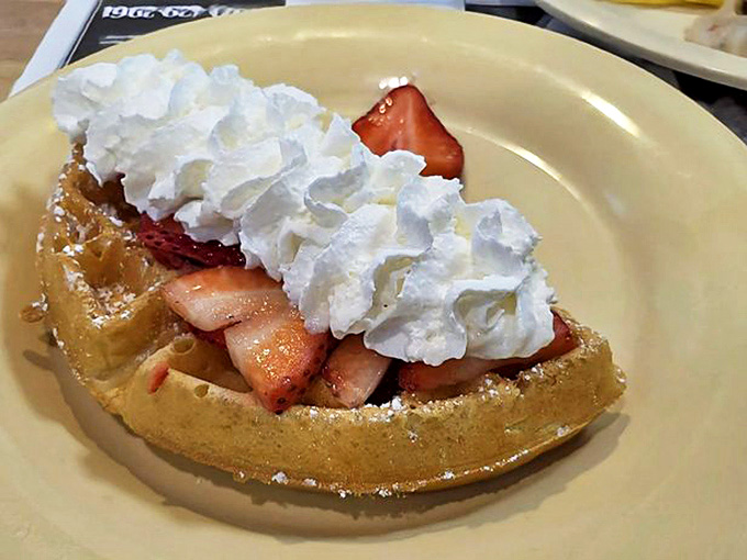This Belgian waffle topped with fresh strawberries and whipped cream is basically dessert masquerading as breakfast.