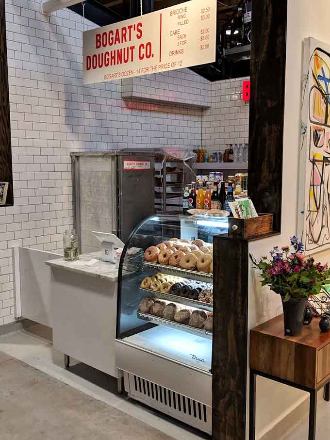 Behind that counter, skilled hands create the kind of donuts that make people drive across town at dawn.