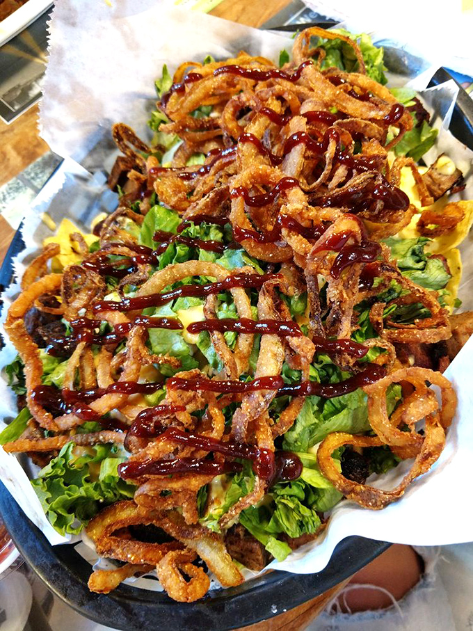 Brisket nachos: Crispy meets tender in this mountain of joy where tortilla chips become delivery vehicles for smoky brisket and melted cheese.