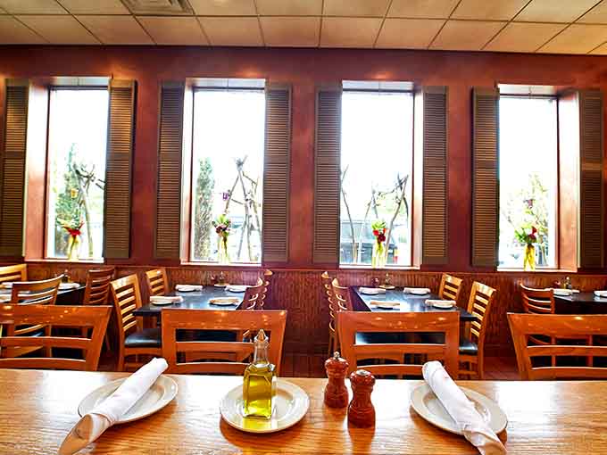 Sunlight streams through the windows, illuminating tables set and ready for hungry pasta lovers to arrive.