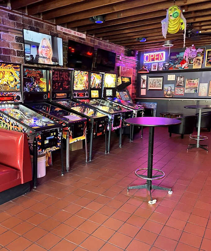 A row of pinball machines stands at attention, each one a portal to a different world of flippers, ramps, and the elusive multiball.