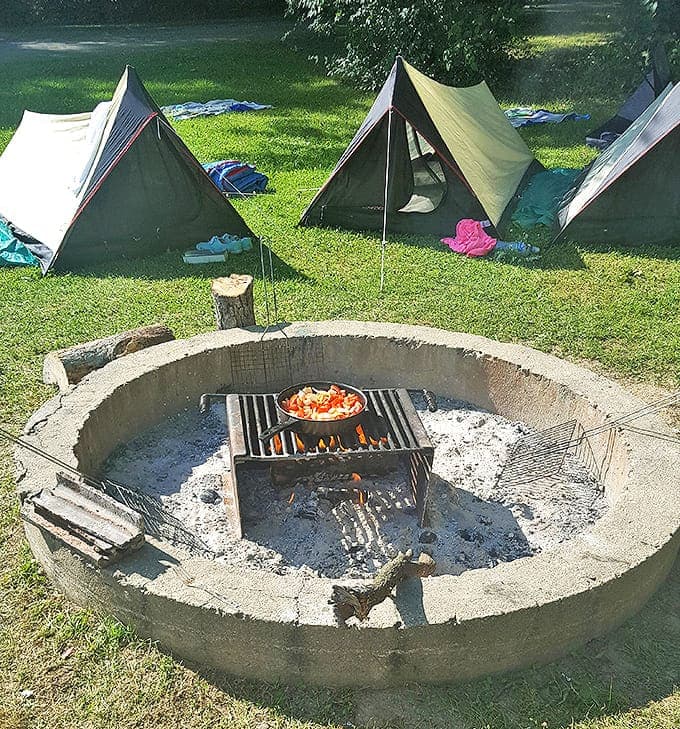 Campfire rings await storytellers and marshmallow roasters, ready to become the heart of evening gatherings where laughter mingles with woodsmoke.
