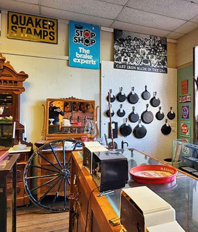 Cast iron cookware that's outlived several generations of cooks hangs with quiet dignity, seasoned with decades of family meals and kitchen wisdom.