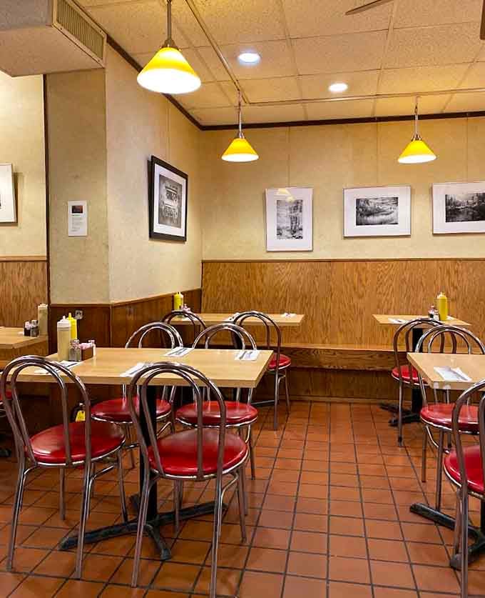 The dining room's warm lighting and vintage photos create an atmosphere that makes you want to linger over coffee.