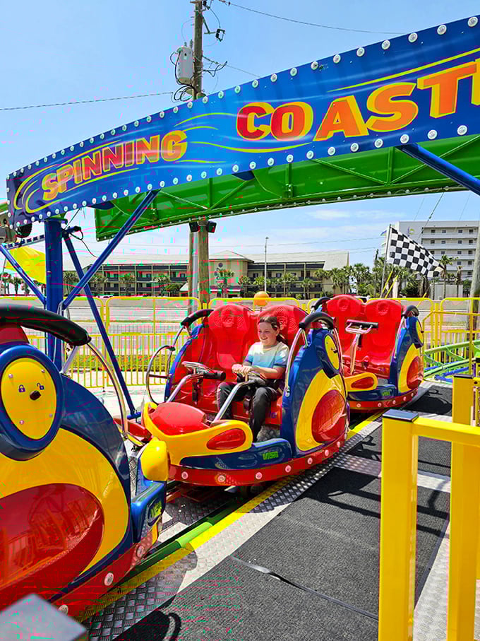 Coaster carriages await their next batch of thrill-seekers – stomachs will drop while spirits soar on this colorful contraption.