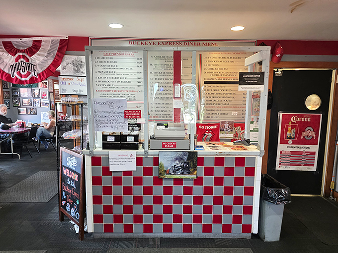 The order counter beckons with its checkerboard charm, promising delicious treasures from the kitchen beyond.